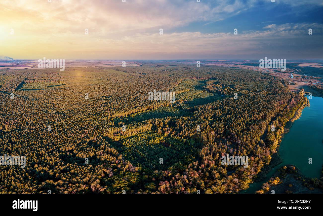 Narrow calm river branches running across autumn landscape with ...