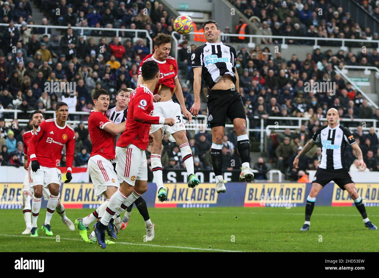 Javi Manquillo of Newcastle in action with Nemanja Matic of Manchester ...