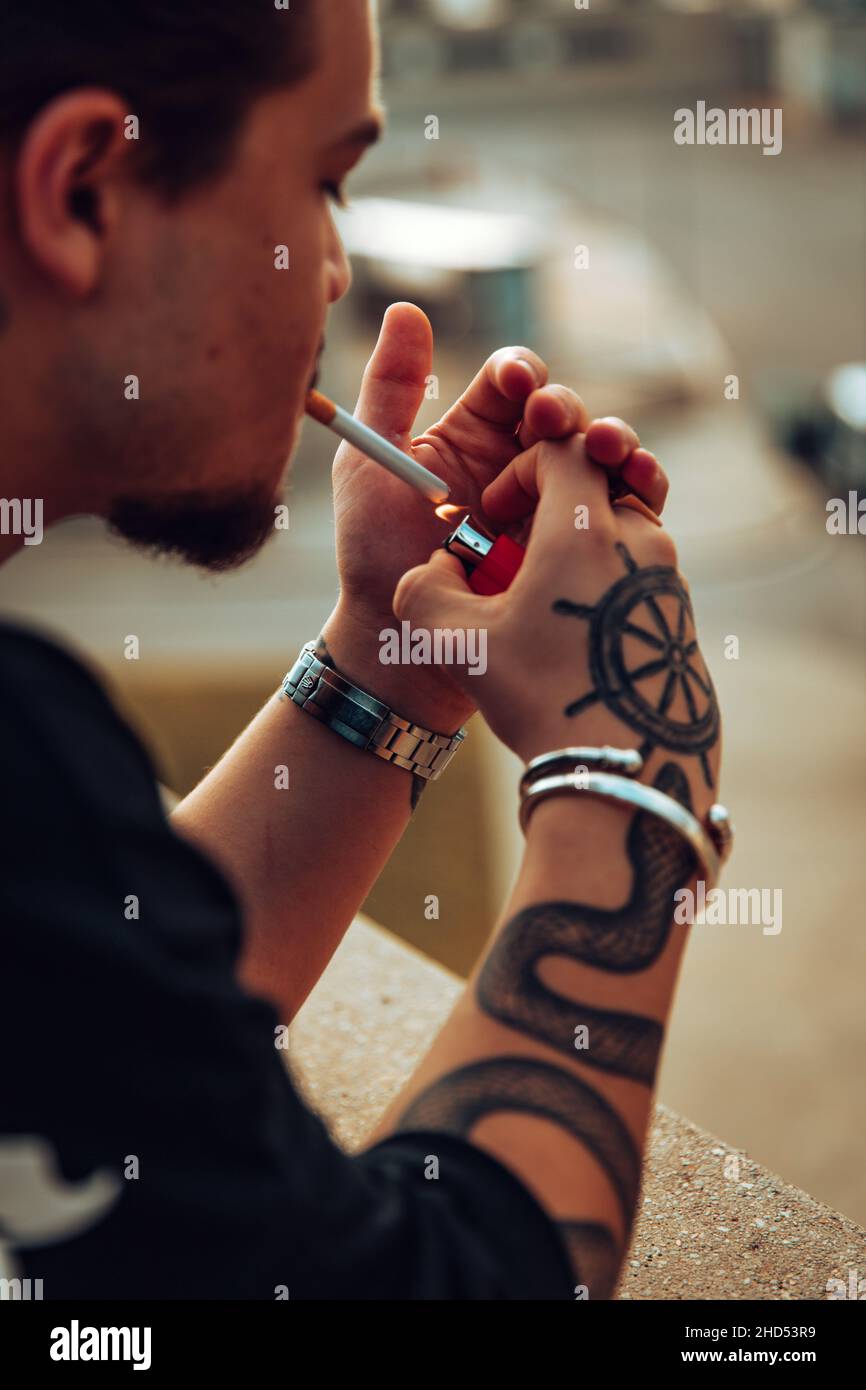 Sad person smoking hi-res stock photography and images - Alamy