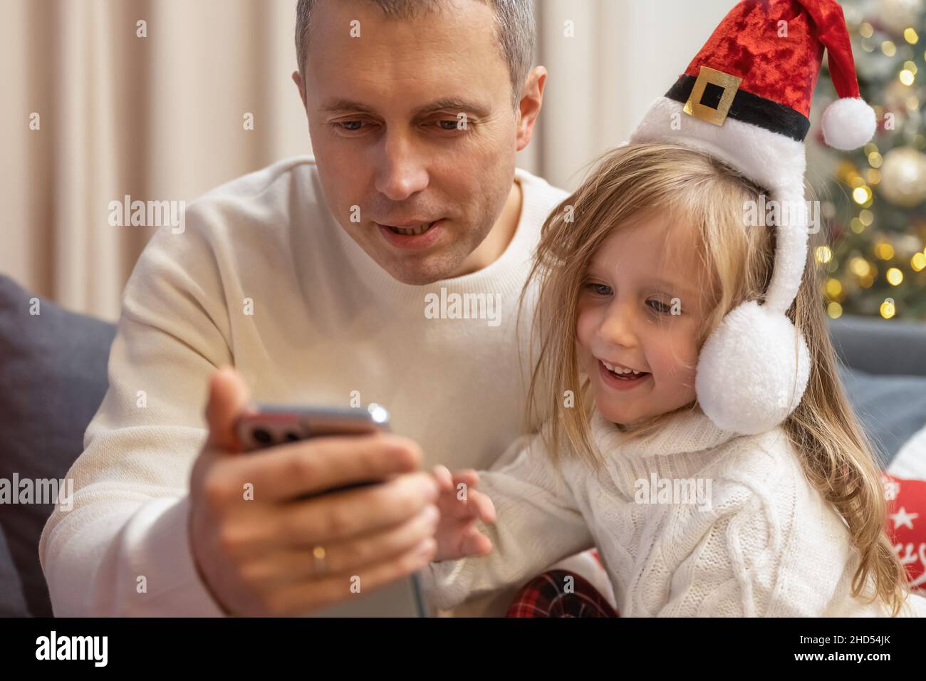 father and daughter talking on video call Stock Photo - Alamy