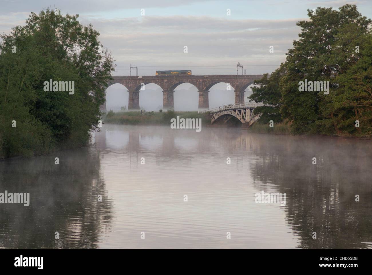 Freightliner class 66 diesel locomotive crossing Dutton viaduct on the ...