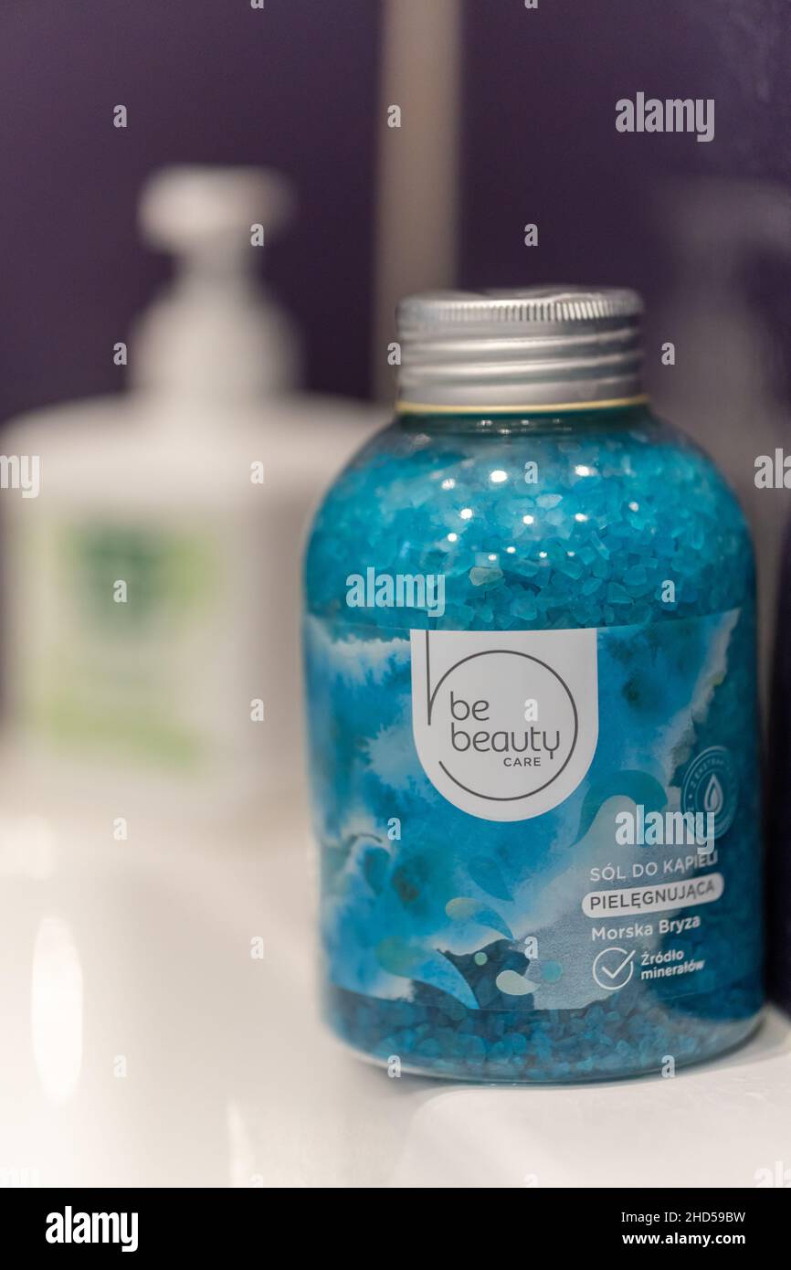 Vertical shot of Be Beauty brand blue bathing salt in a plastic bottle ...
