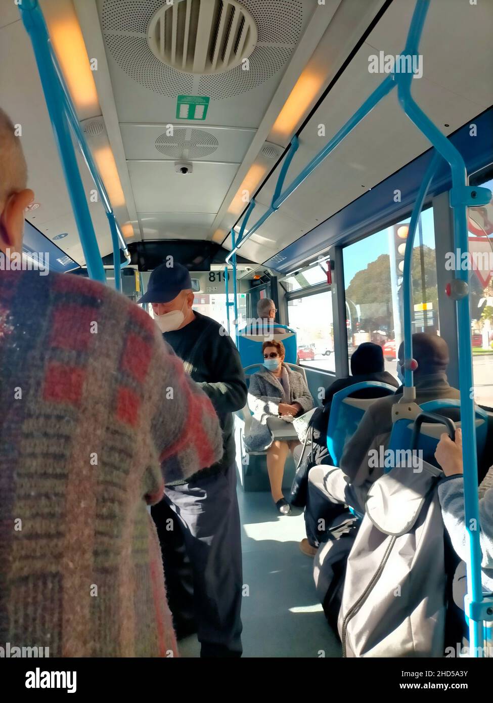 Shot inside a public modern bus with passengers in Alicante, Spain ...