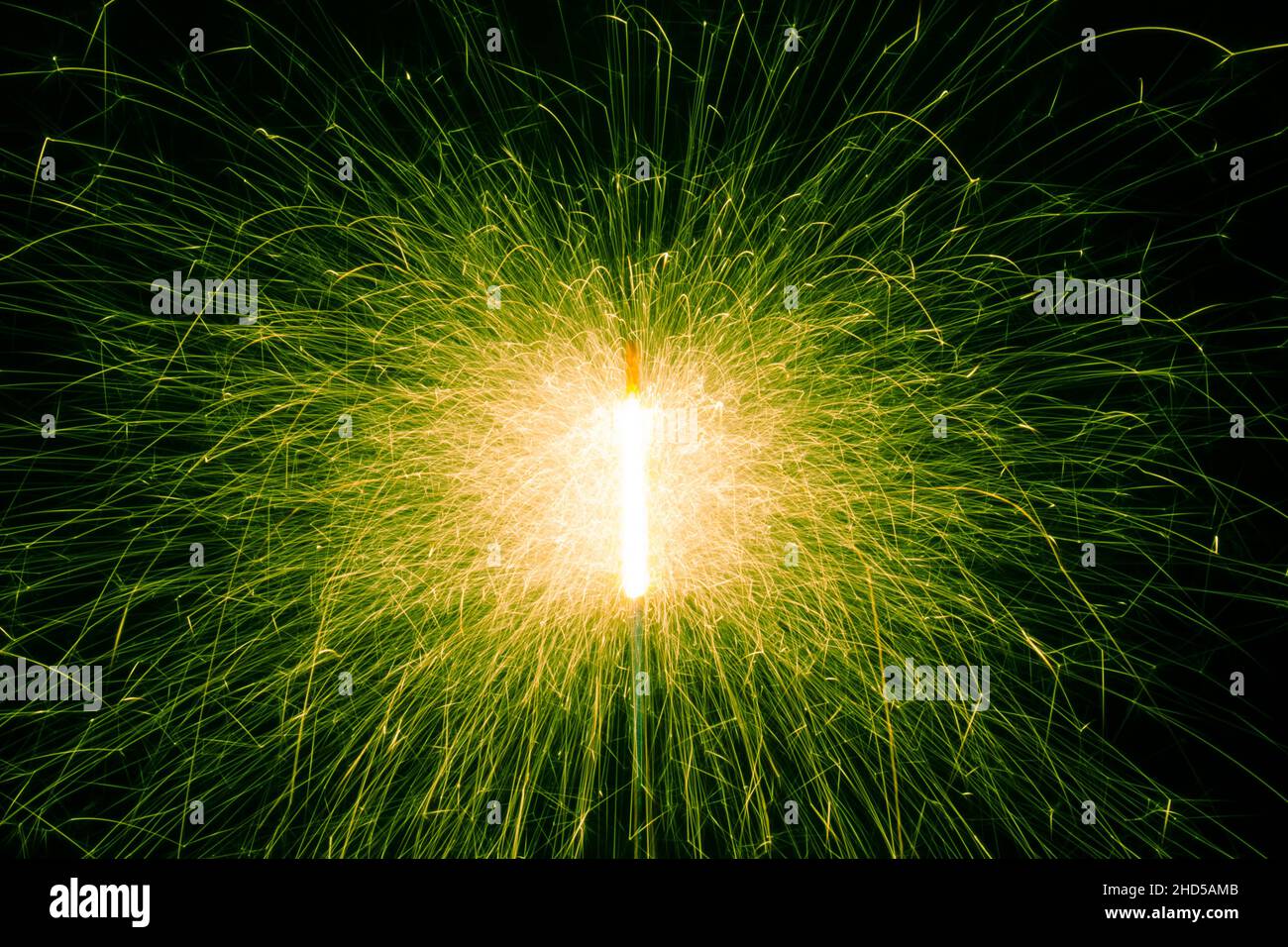 Sparkler, green sparks on a black background. Abstract photo of sparks ...