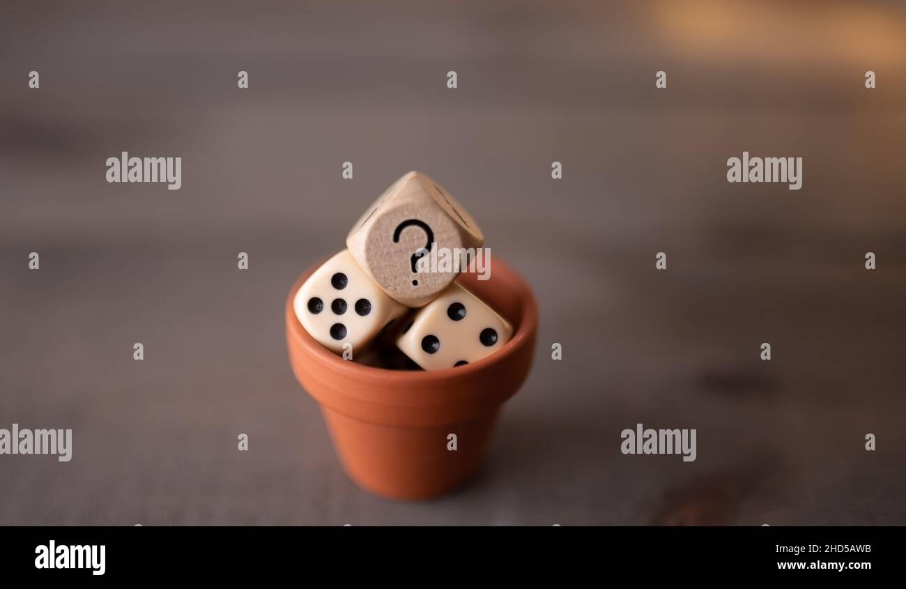 game dice with question mark, in front of wooden background Stock Photo ...