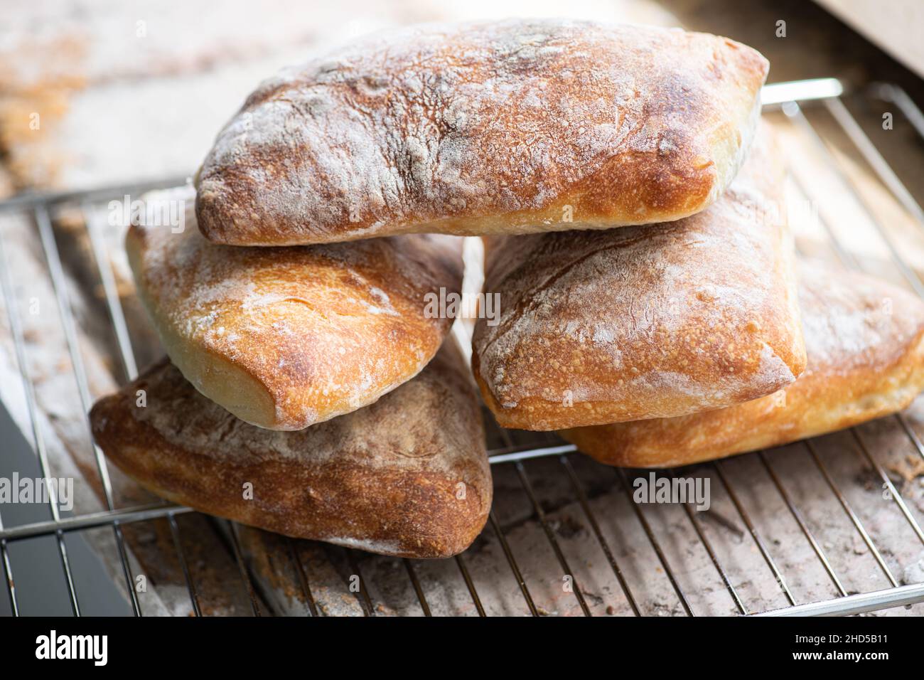 Batch of ciabatta bread on a cooling rack. Close up Stock Photo - Alamy