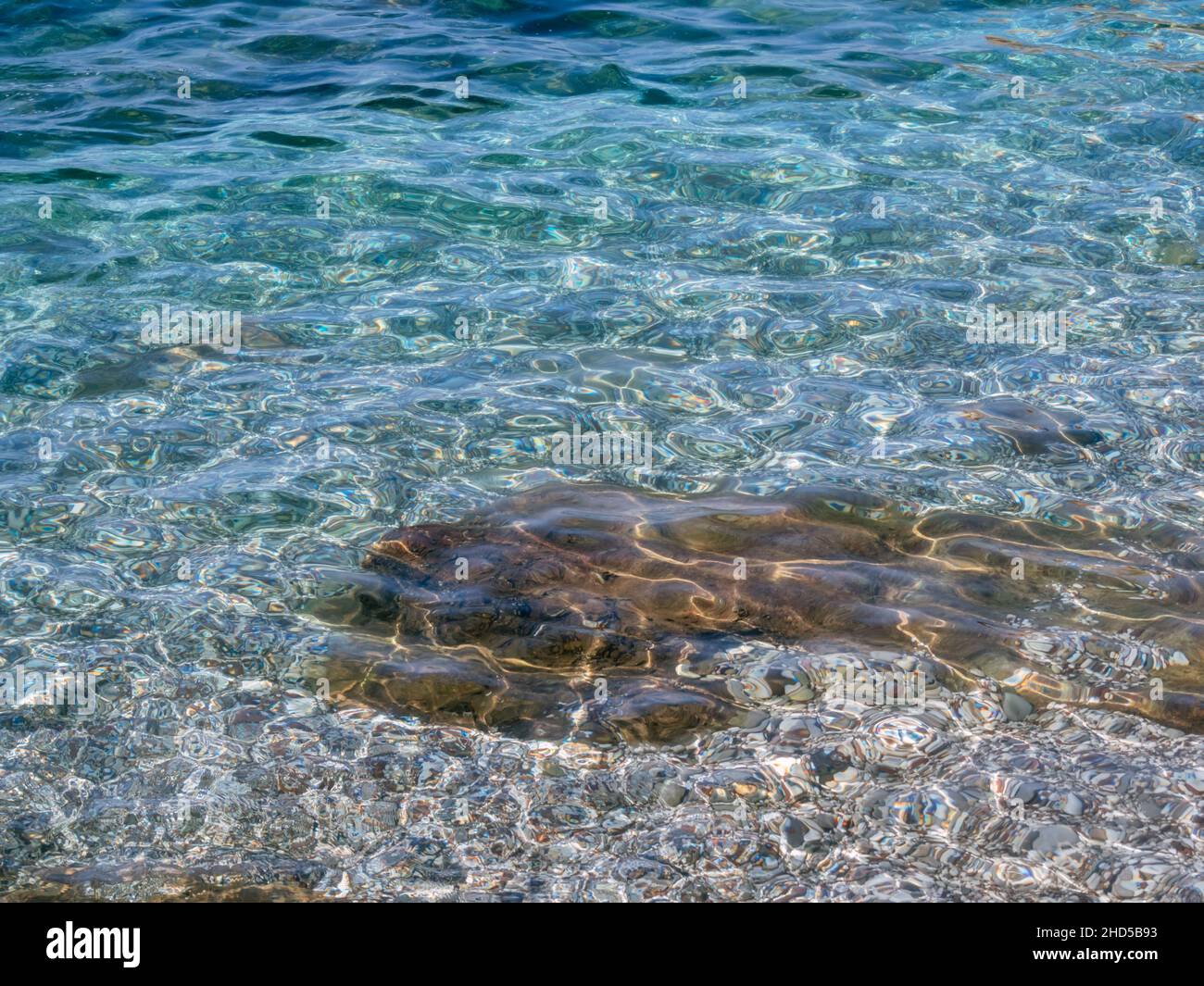 Sunlight reflects on a sea surface. Abstract water background. Clean ...
