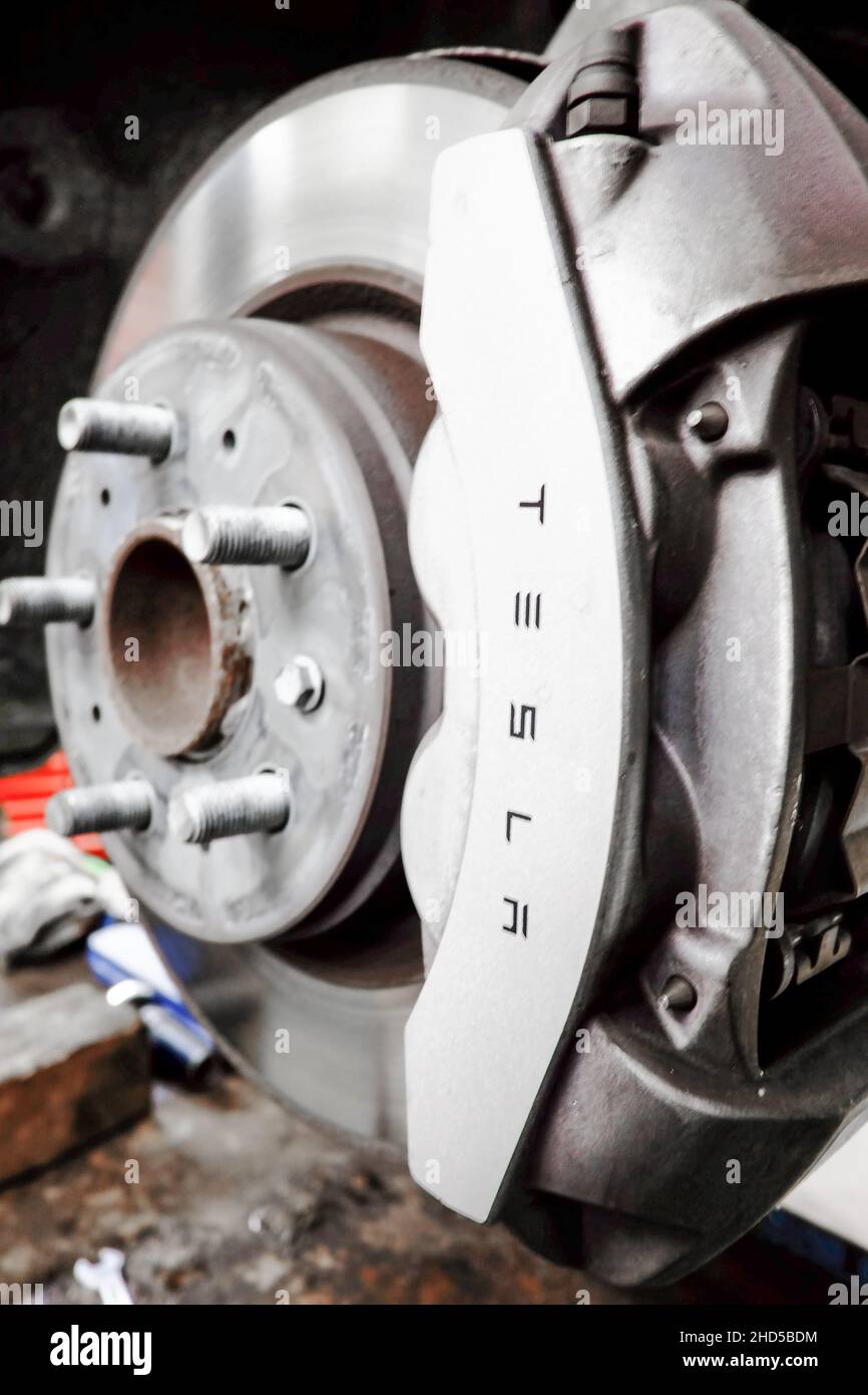 Brake disc with caliper from a Tesla 3 Stock Photo - Alamy