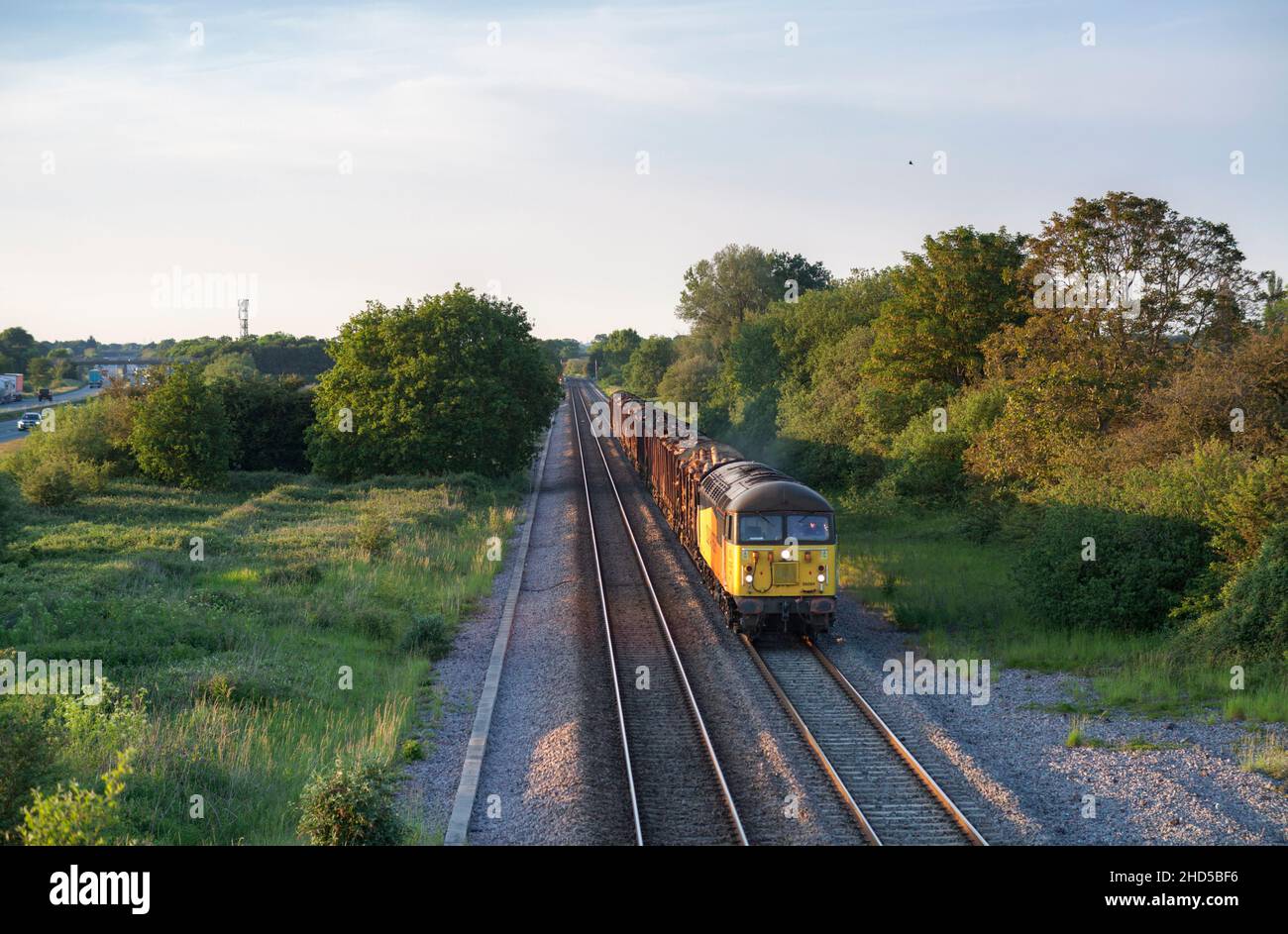 A Colas Railfreight class 56 locomotive hauling a train carrying timber ...