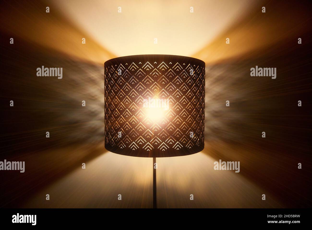 Floor lamp light. Rays of light through the holes in the lamp floor ...