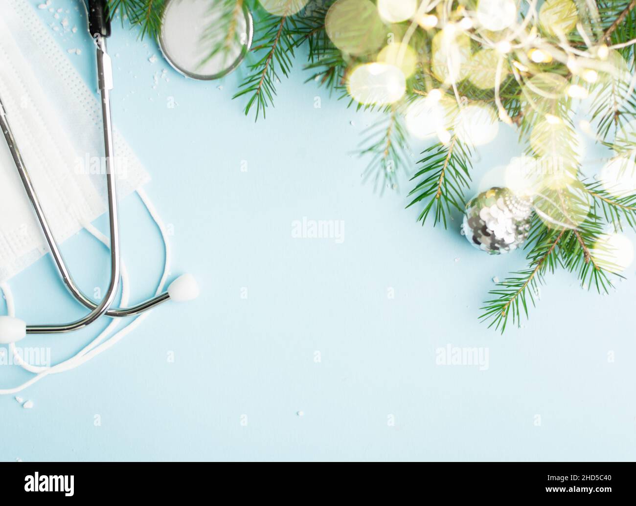 Christmas medical concept with stethoscope, face mask and christmas ...