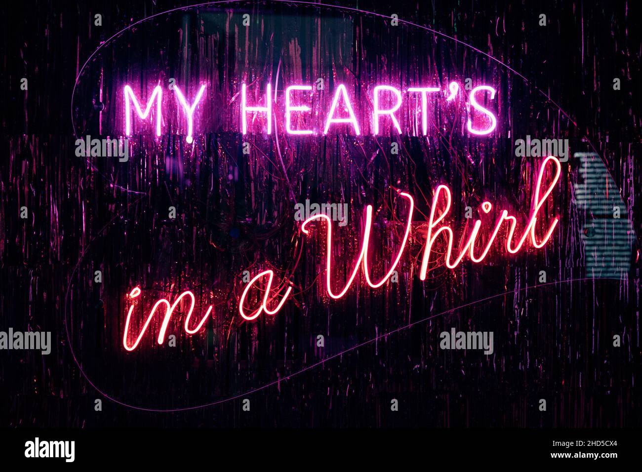 Colorful "My heart's in a whirl" sign with neon lights Stock Photo - Alamy