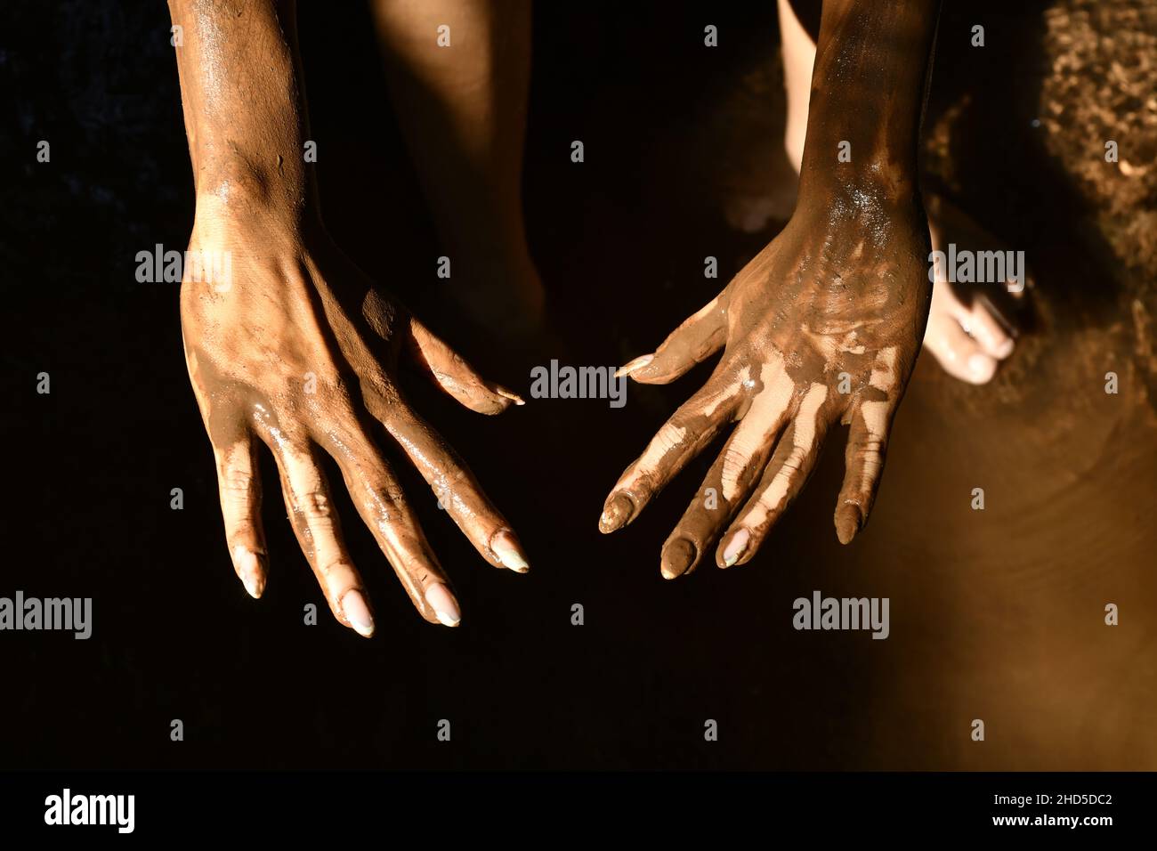 Closeup of female hands in the sand on a beach Stock Photo - Alamy