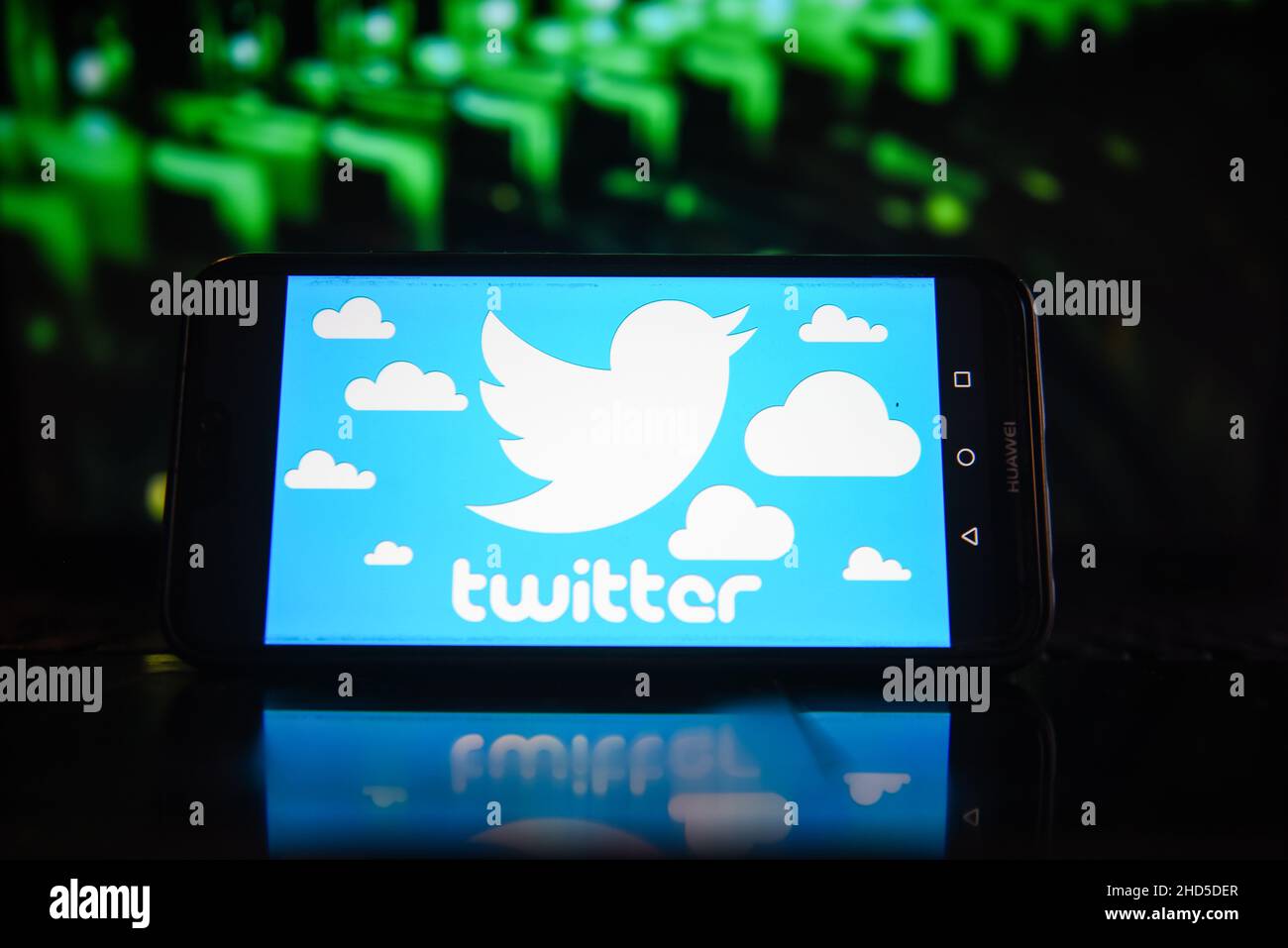 In this photo illustration a Twitter logo seen displayed on a ...