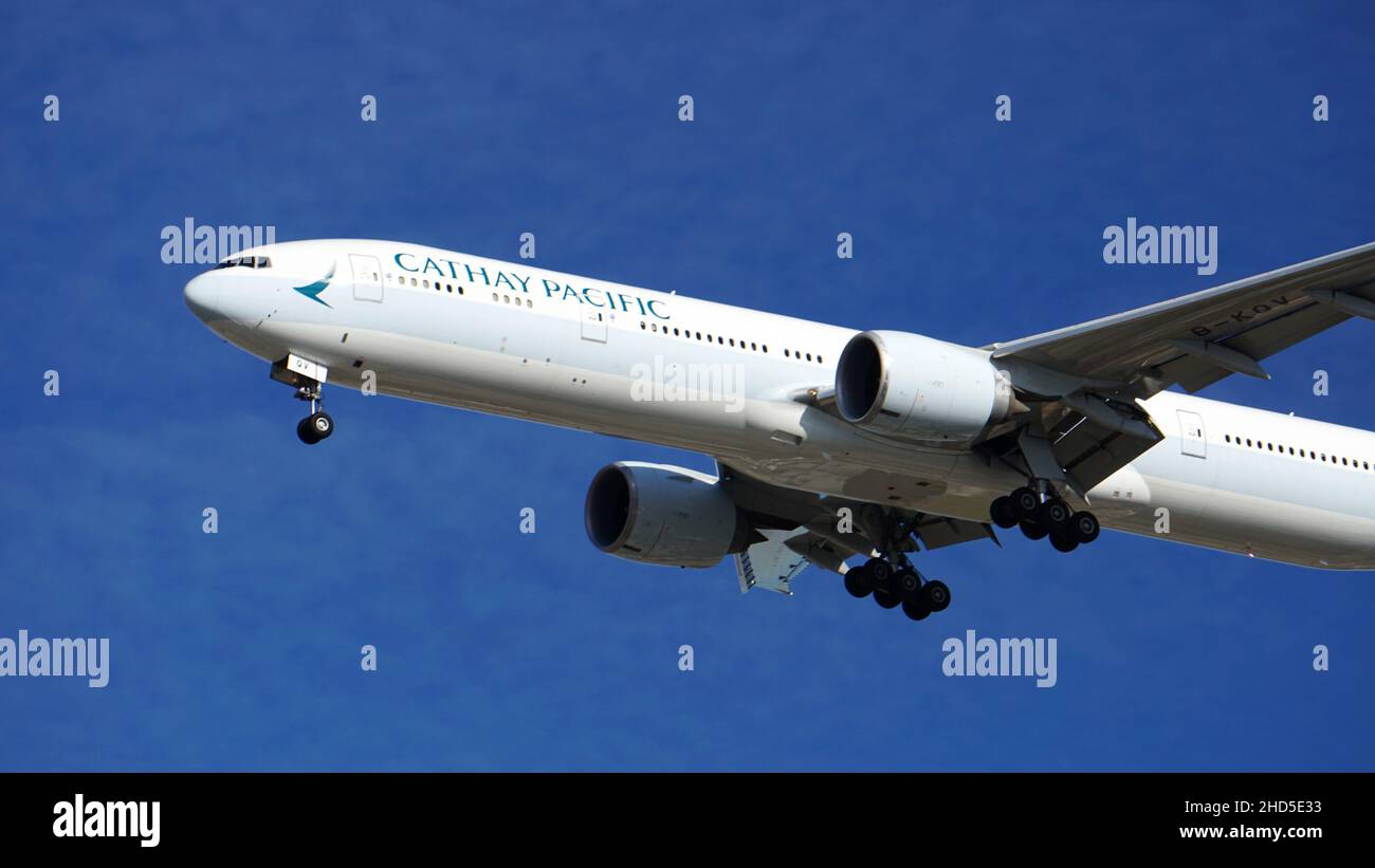 Cathay Pacific Boeing 777 plane in flight preparing to land at Chicago ...