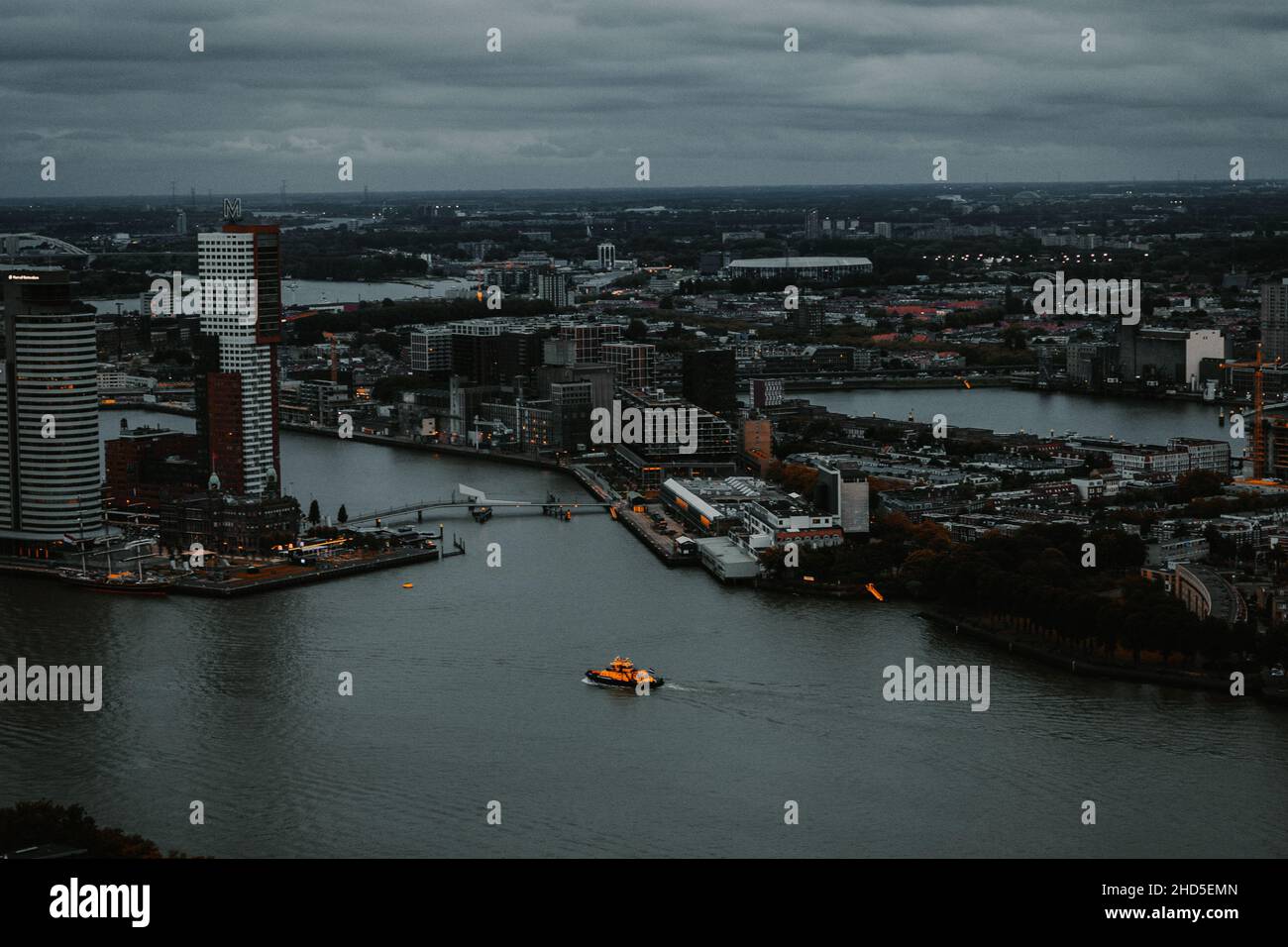 Bird's eye view of a boat in a river and skyscrapers in Rotterdam, the ...