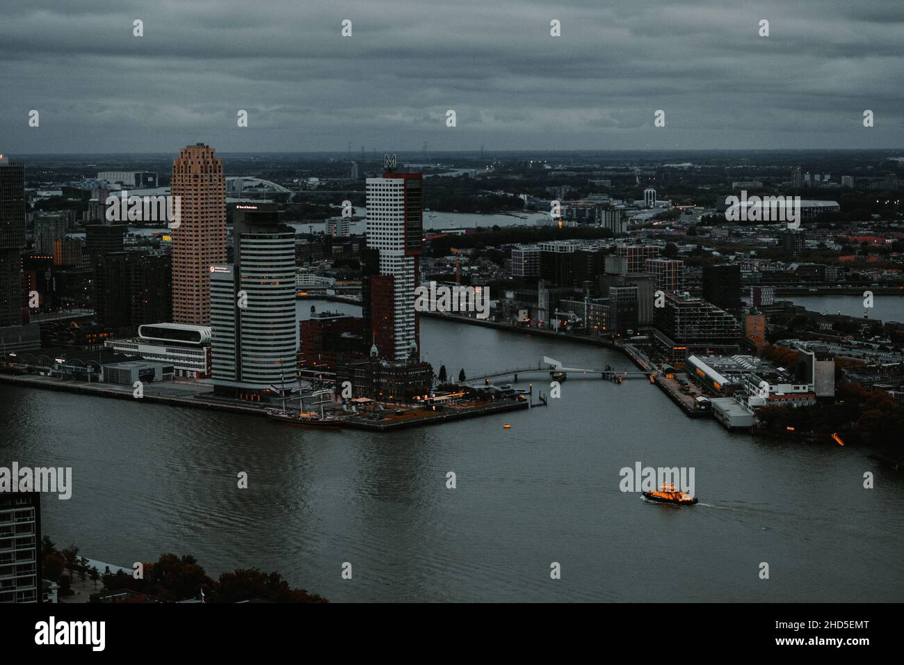 Bird's eye view of a boat in a river and skyscrapers in Rotterdam, the ...
