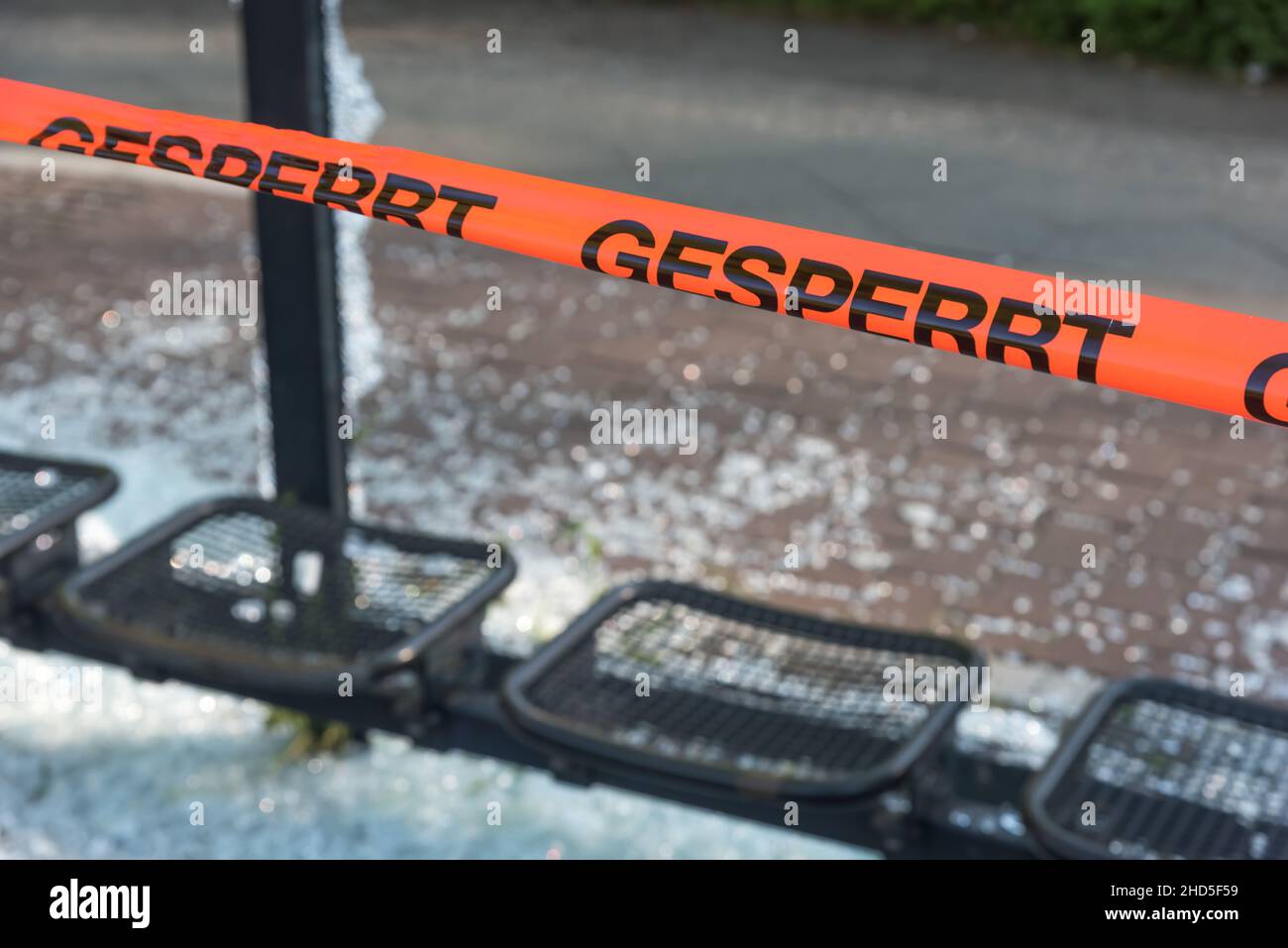 Barrier tape at a demolished bus stop Stock Photo - Alamy