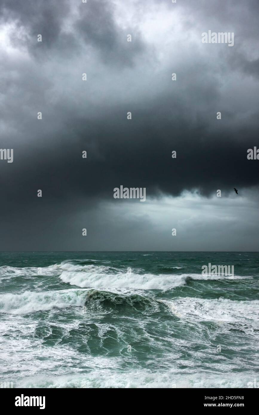 Dark dramatic storm clouds over Fistral Bay in Newquay in Cornwall ...