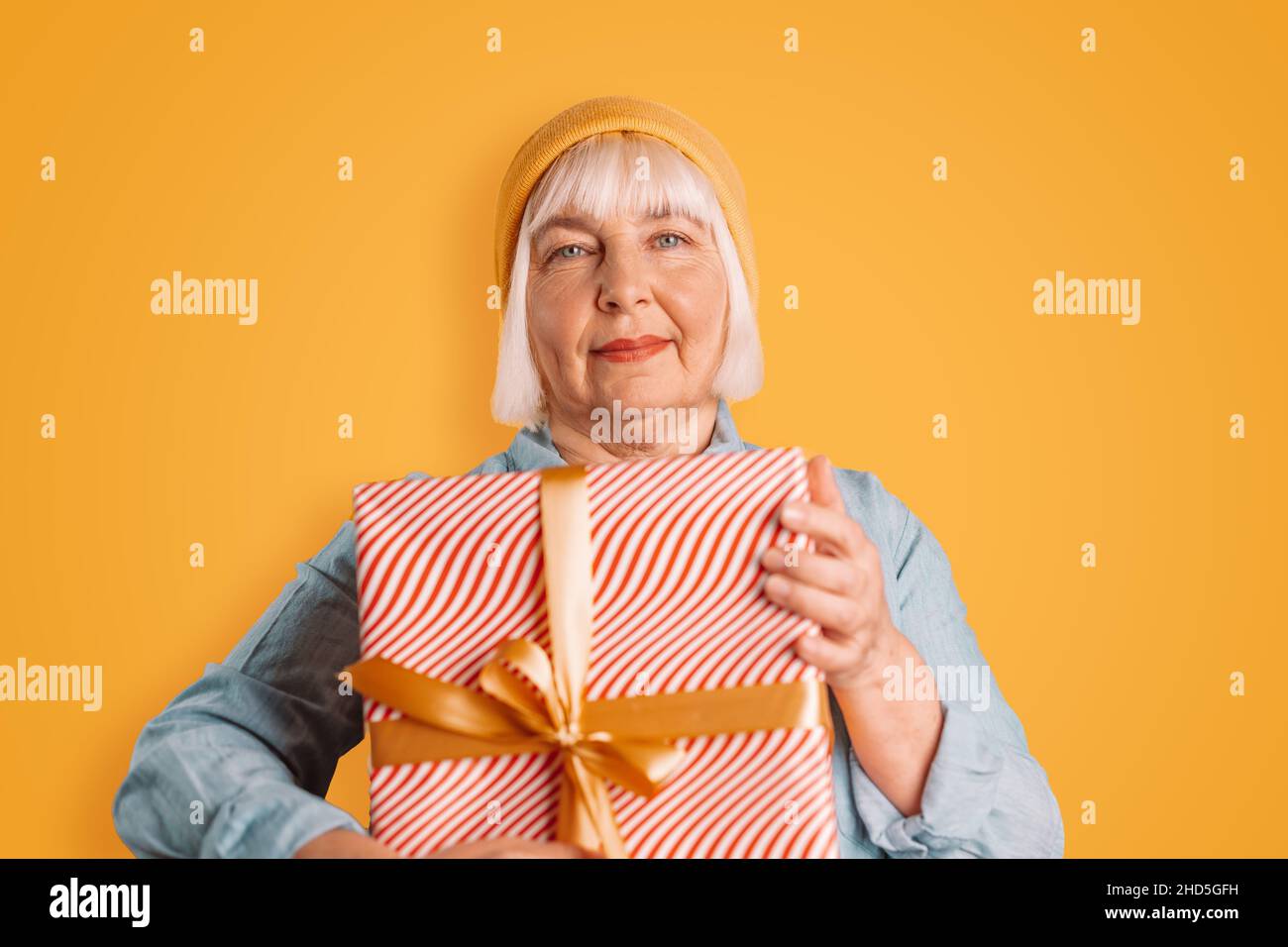 Photo of cheerful positive woman hold gift box present for 8 march ...