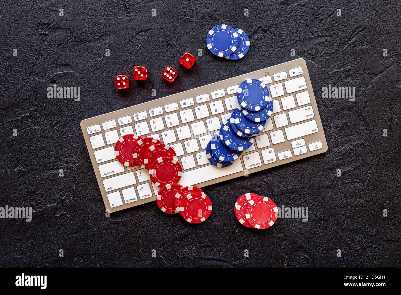 Poker chips with keyboard. Online casino games concept Stock Photo - Alamy