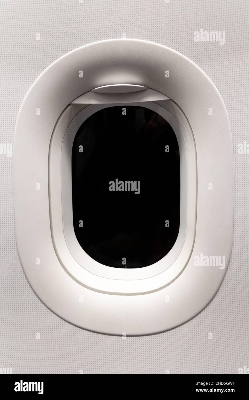 Fully open airplane window shade Stock Photo - Alamy