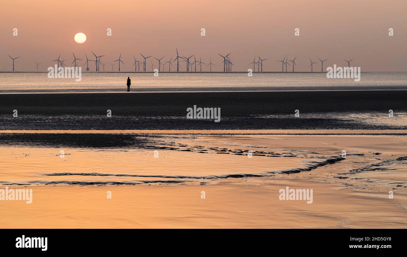 Colourful sunlight reflects off the silt on Crosby beach Stock Photo ...