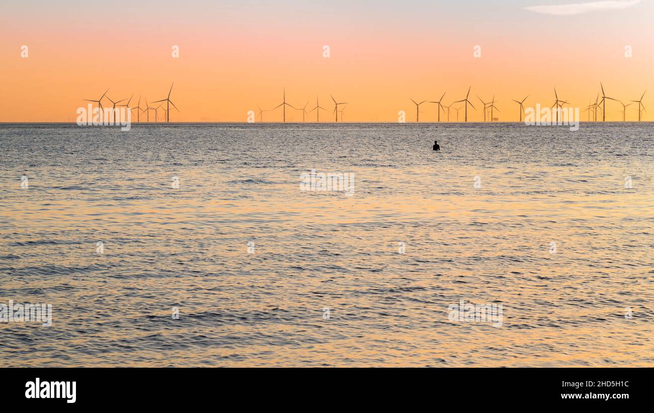 An isolated Iron Man seen at high tide on Crosby beach watching the ...