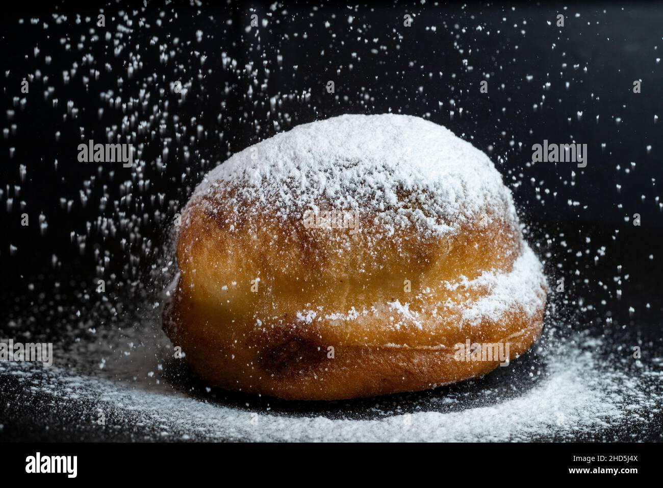 fat donut powdered with vanilla sugar Stock Photo - Alamy