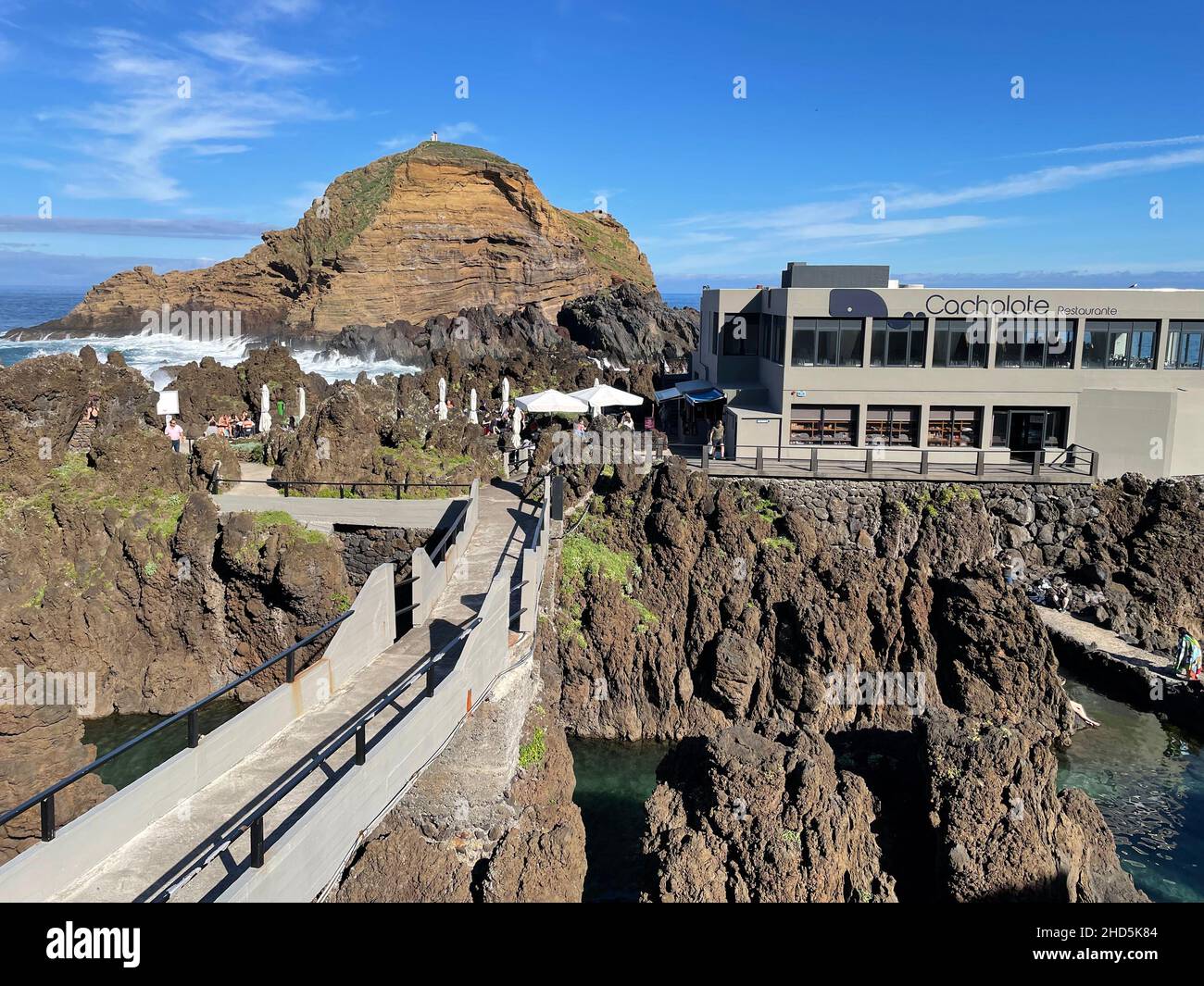 CACHALOTE, Madeira. Restaurant on volcanic rock at Port Moniz with the ...