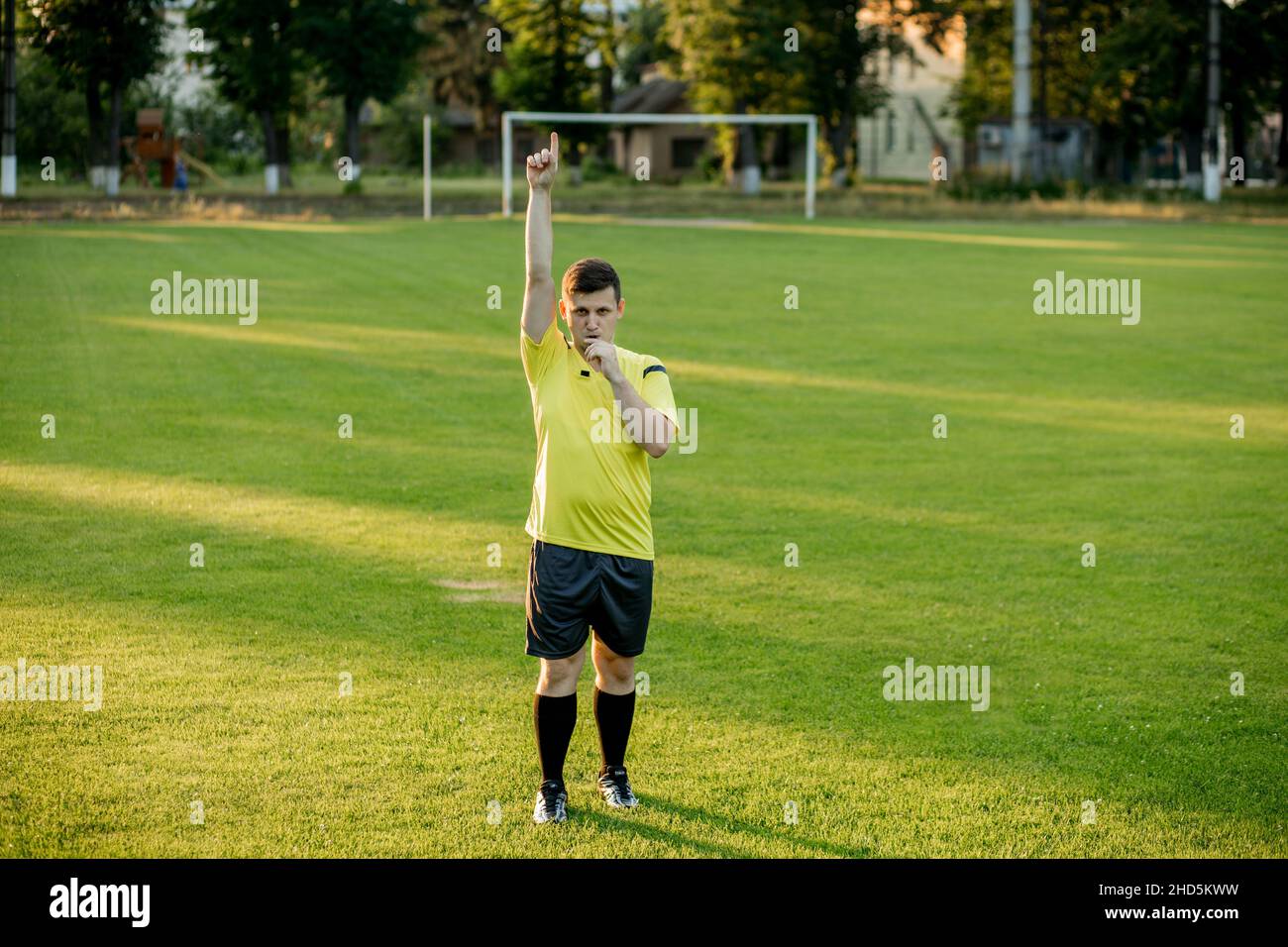 Referee indicates offside. Concept of sport, rules violation, offside ...