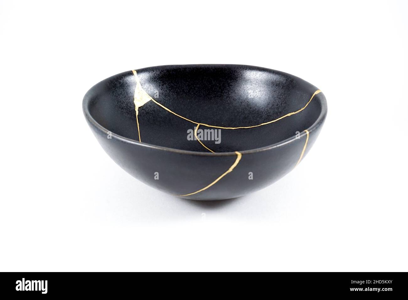 kintsugi gold cracks restoration, Japanese black bowl fixed with the ...