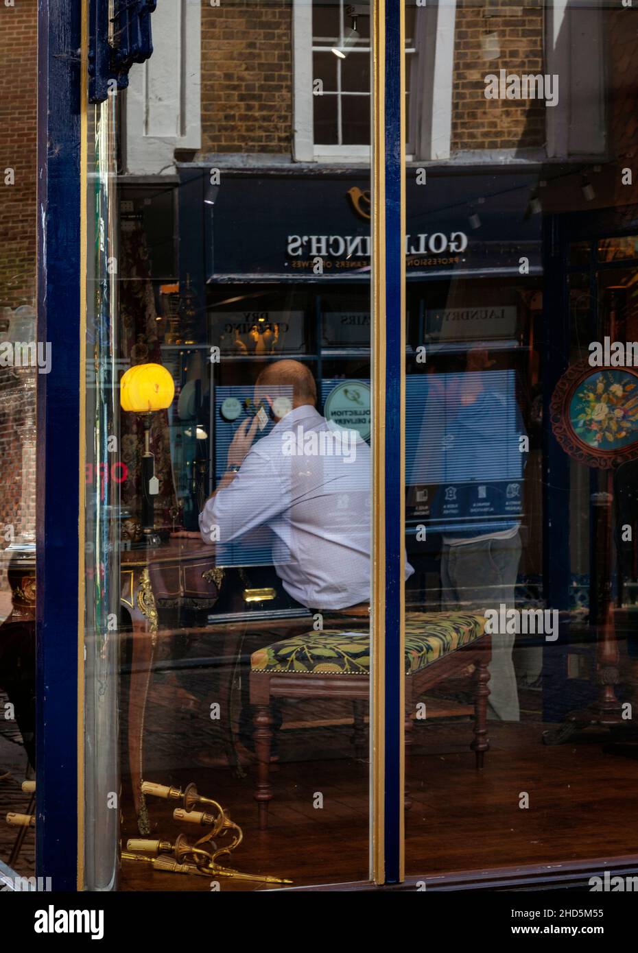 Through an antique shop in A shop window in Lewes, the county town of ...