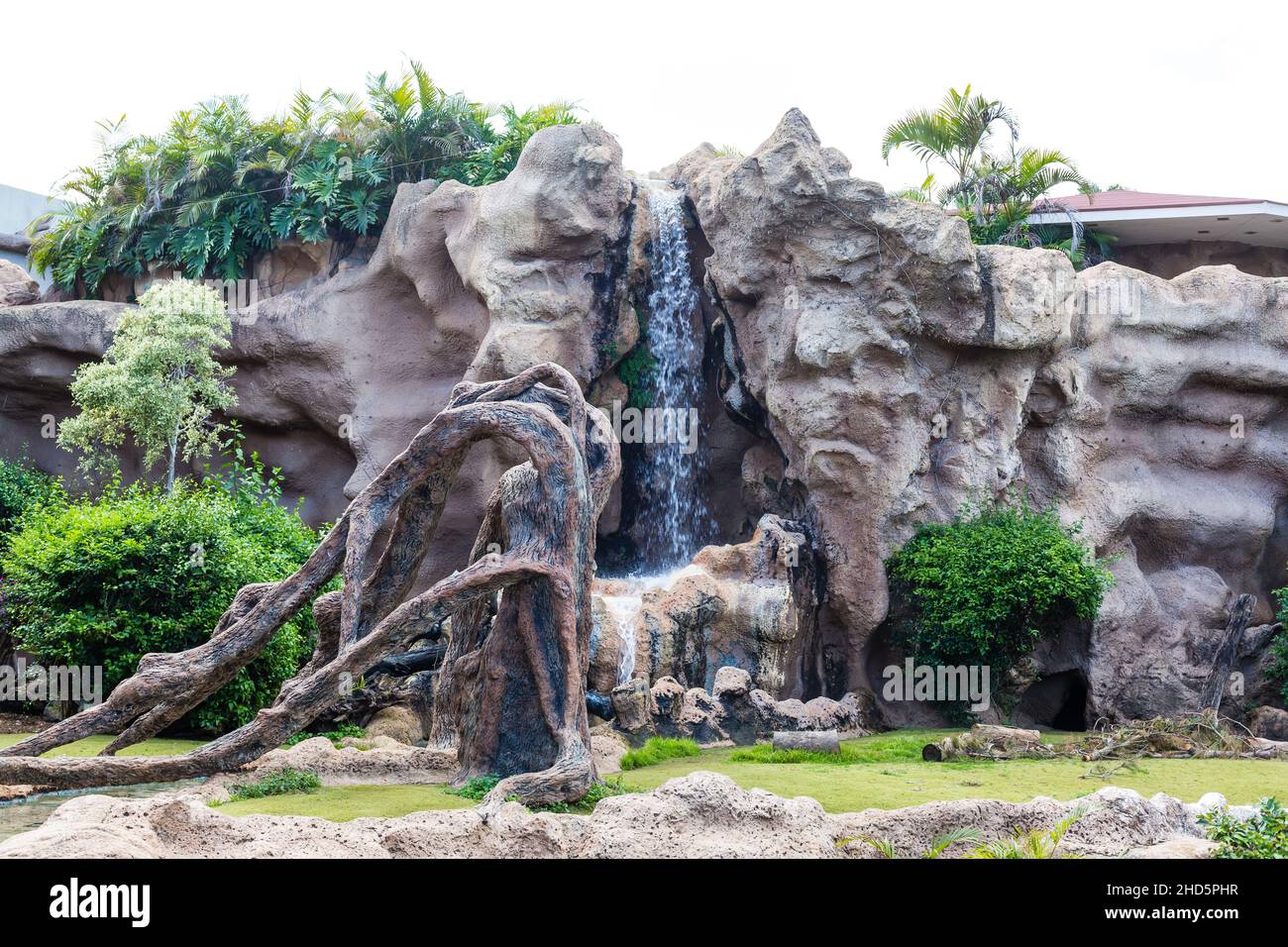 A small decorative waterfall in the garden. Landscape design Stock ...