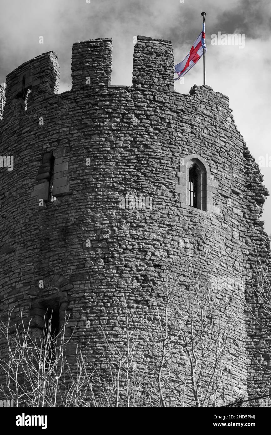 The flag of St George picked out in colour flying above the black and ...