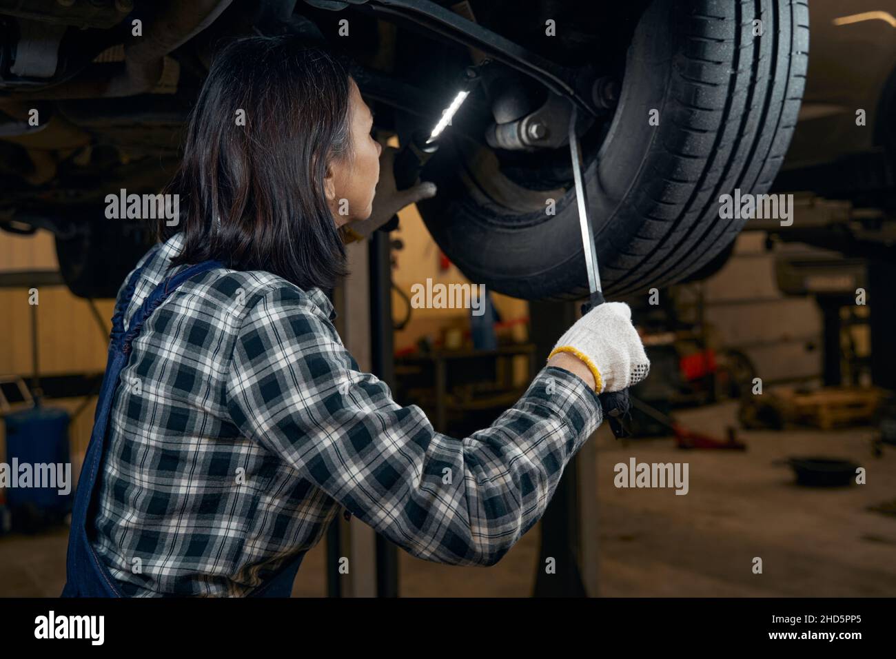 Focused woman repairing servicing hi-res stock photography and images ...