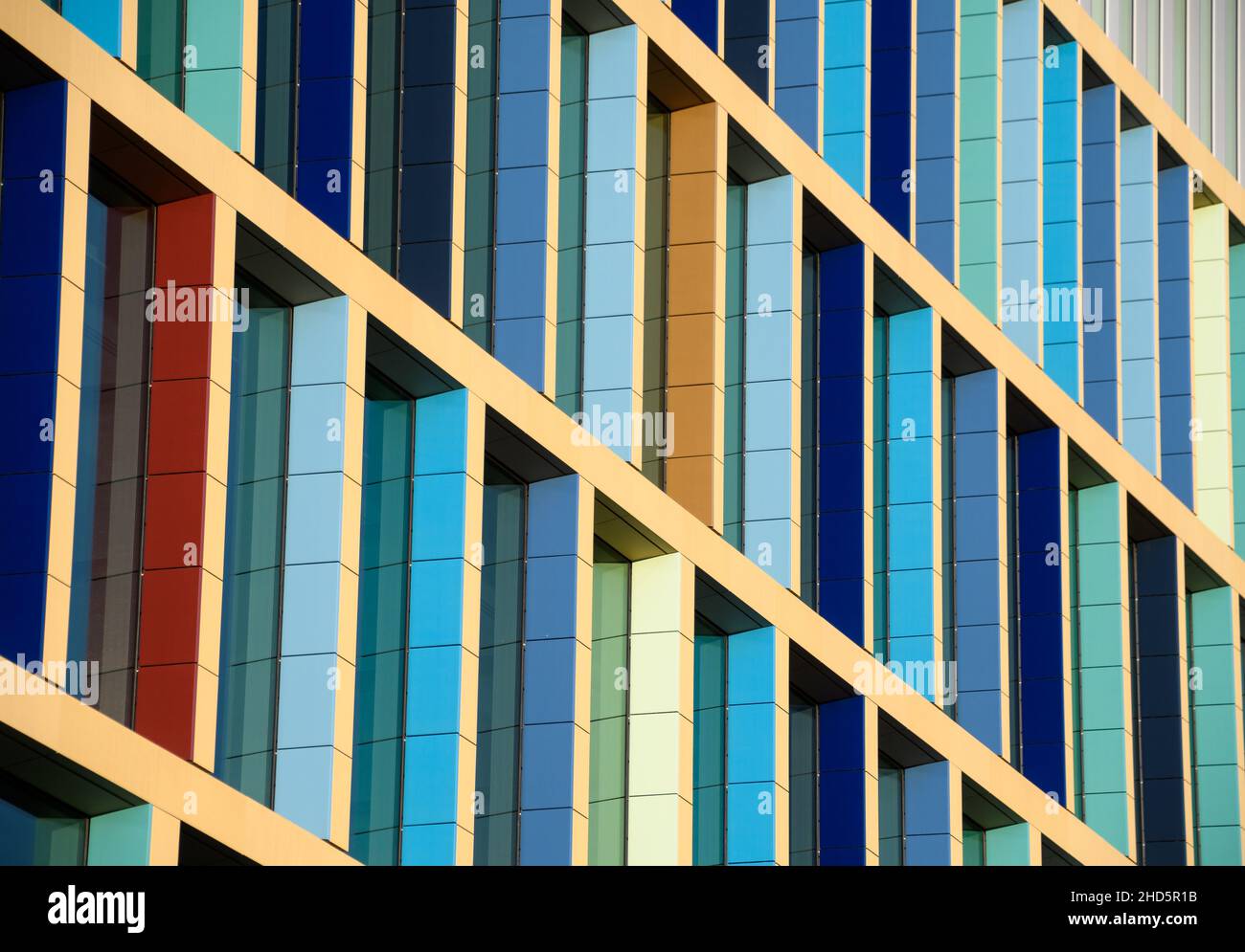 A shot showing the colourful window frames of a block of flats Stock ...