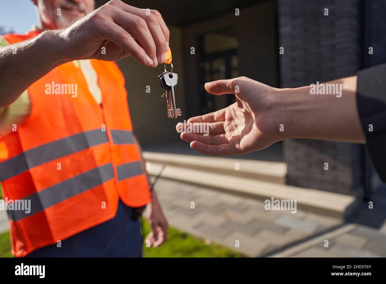 Hand giving key another hand hi-res stock photography and images - Alamy