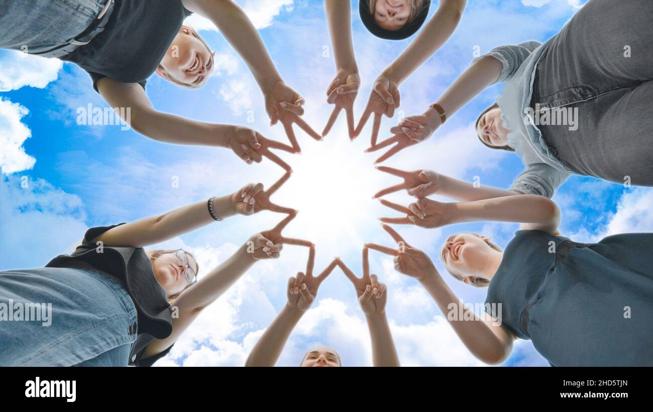 Girlfriends girls make circle shapes from their fingers and hands and ...