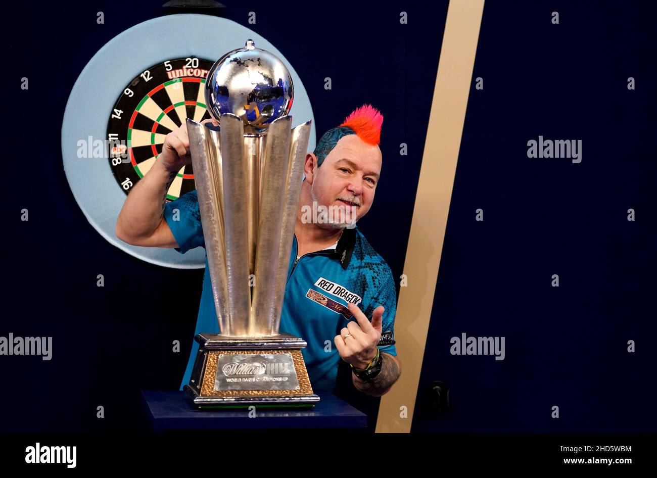 Peter Wright celebrates with the Sid Waddell Trophy after victory ...