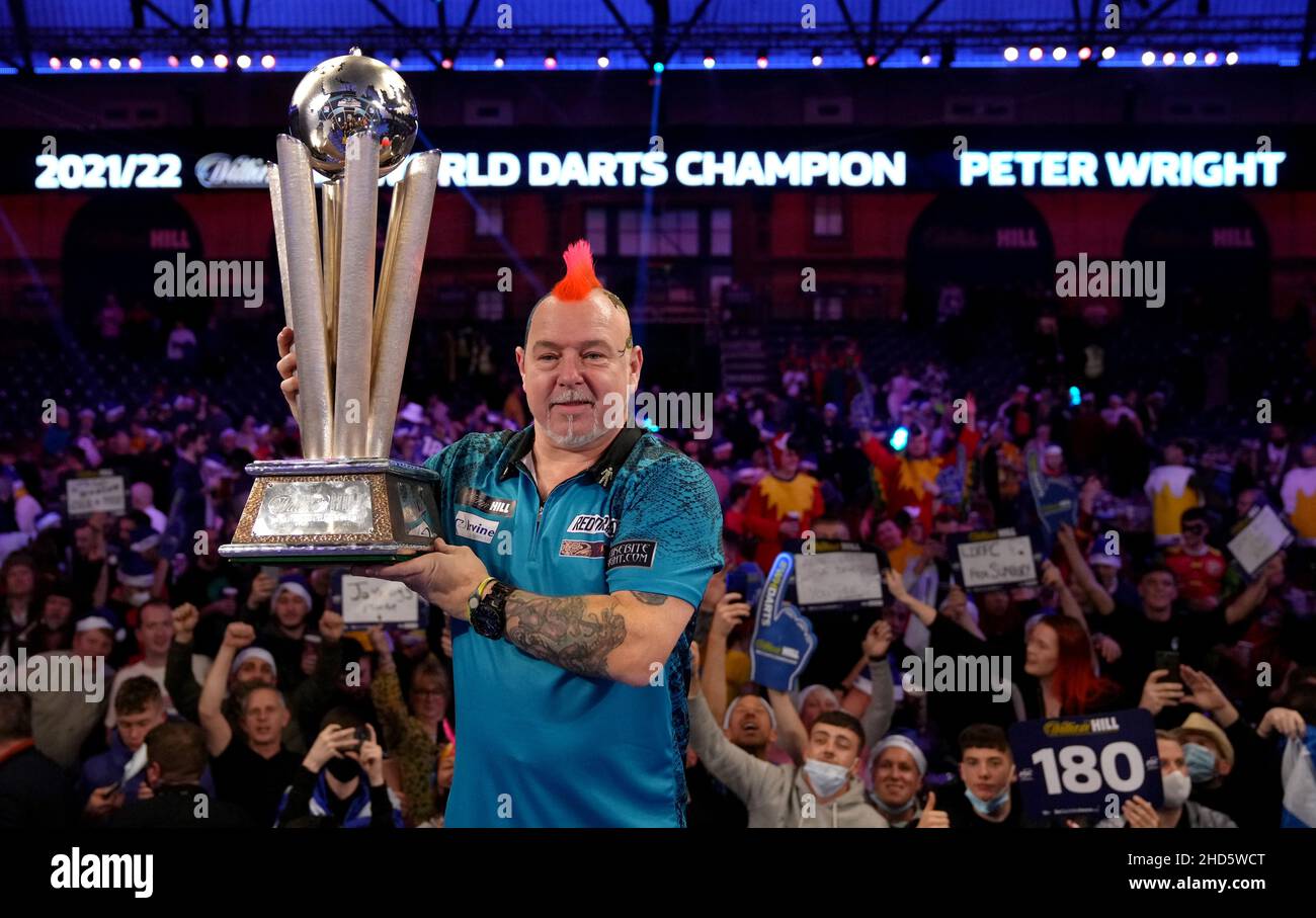 Peter Wright celebrates with the Sid Waddell Trophy after victory ...