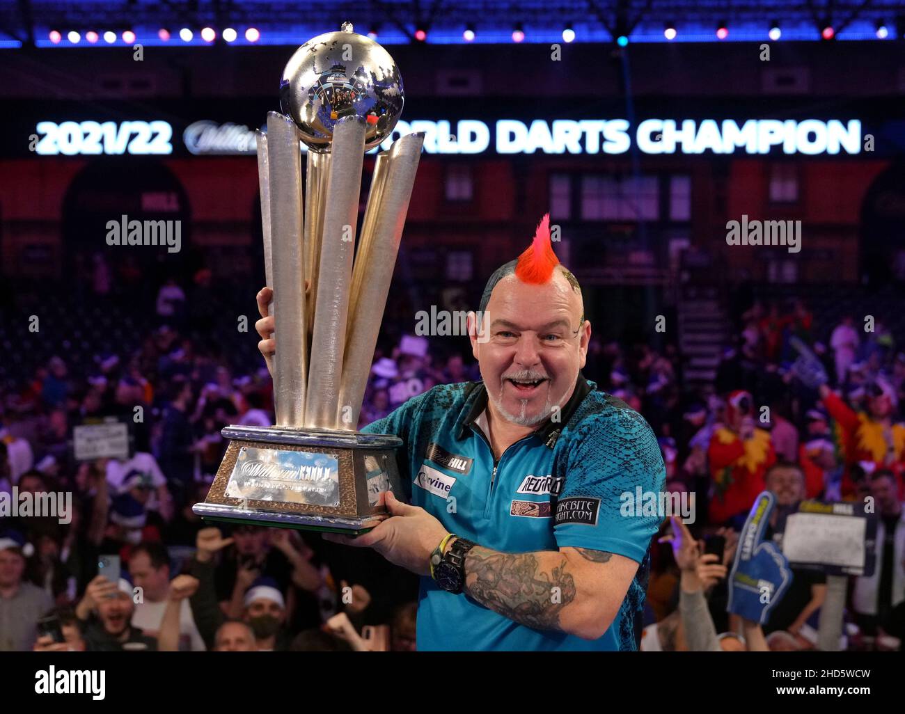 Peter Wright celebrates with the Sid Waddell Trophy after victory ...