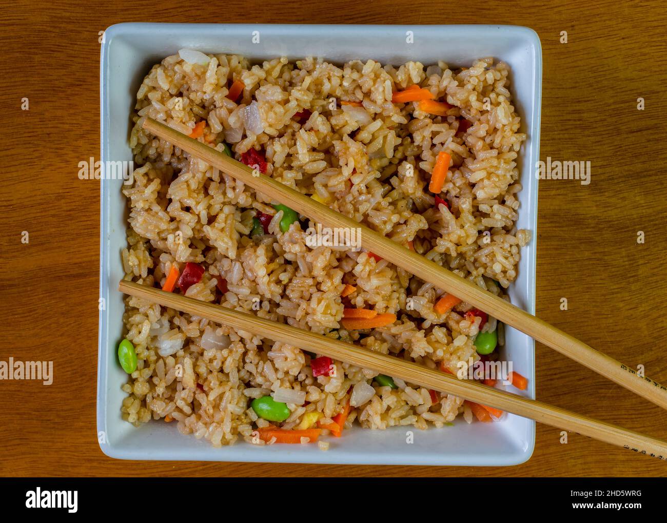 bowl of fresh vegetable fried rice with chop sticks Stock Photo - Alamy