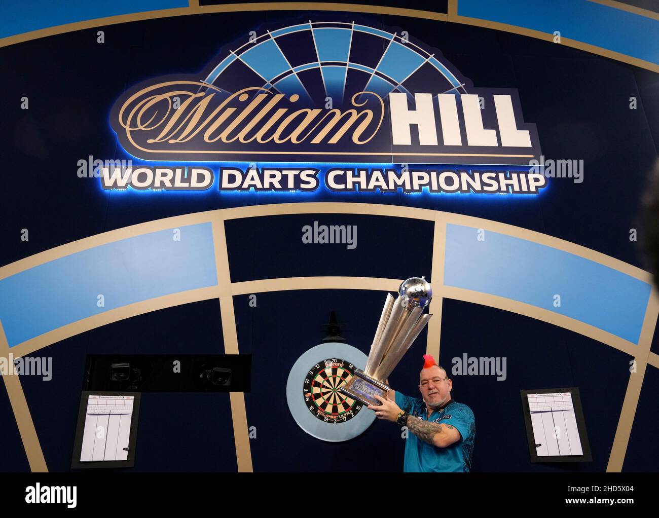 Peter Wright celebrates with the Sid Waddell Trophy after victory ...