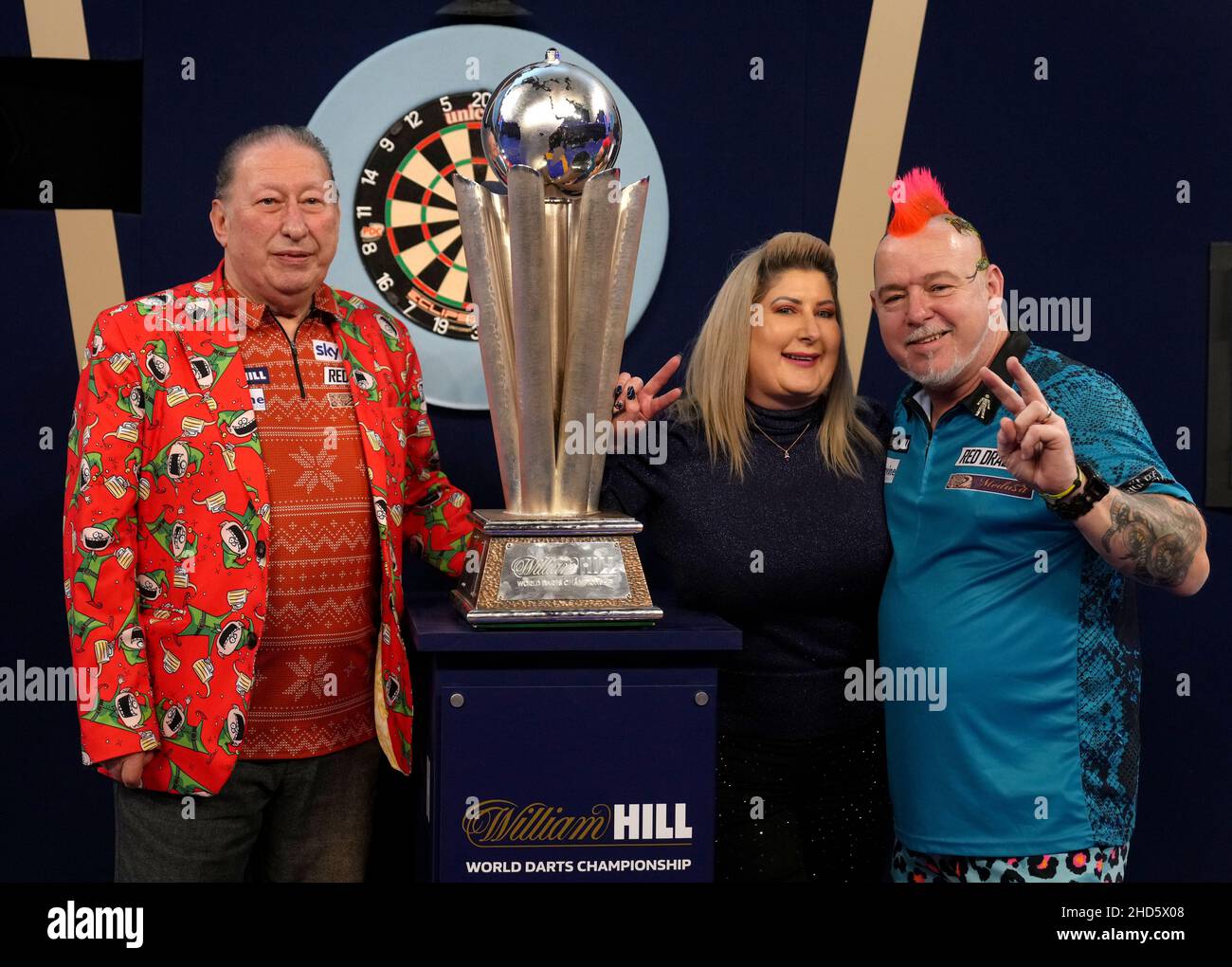 Peter Wright (right) celebrates with wife Joanne, her father Paul and ...