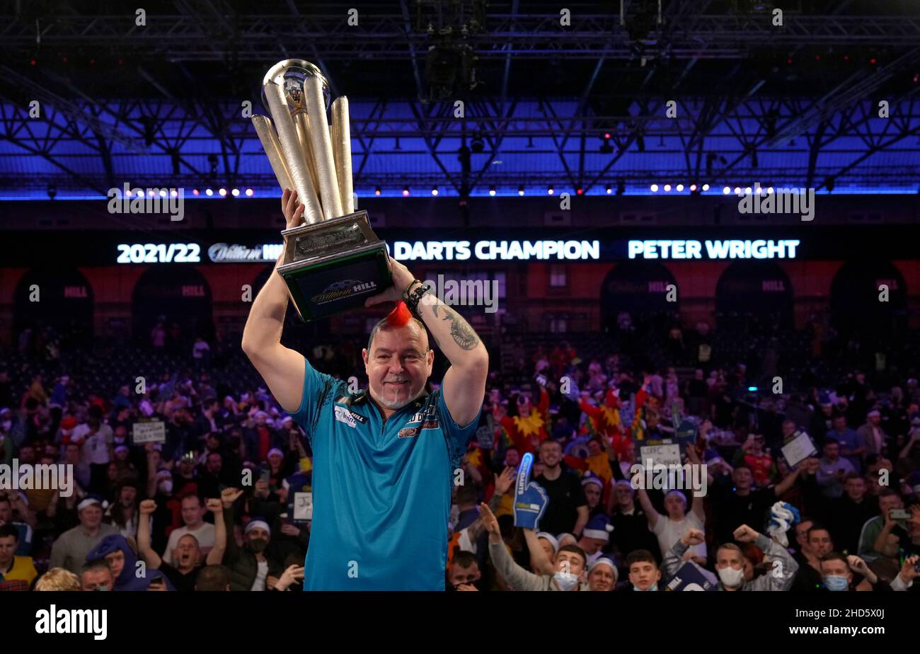 Peter Wright celebrates with the Sid Waddell Trophy after victory ...