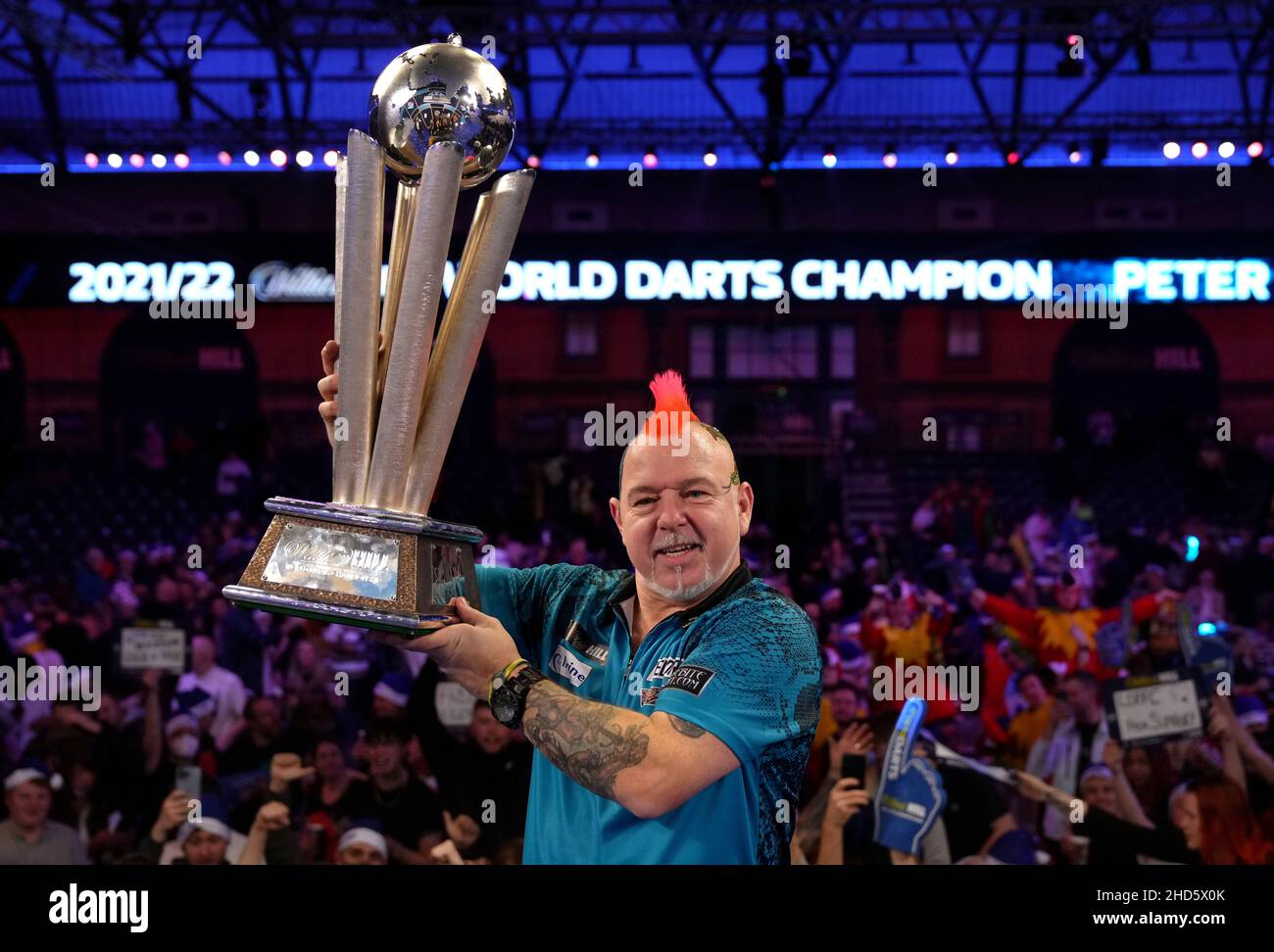 Peter Wright celebrates with the Sid Waddell Trophy after victory ...