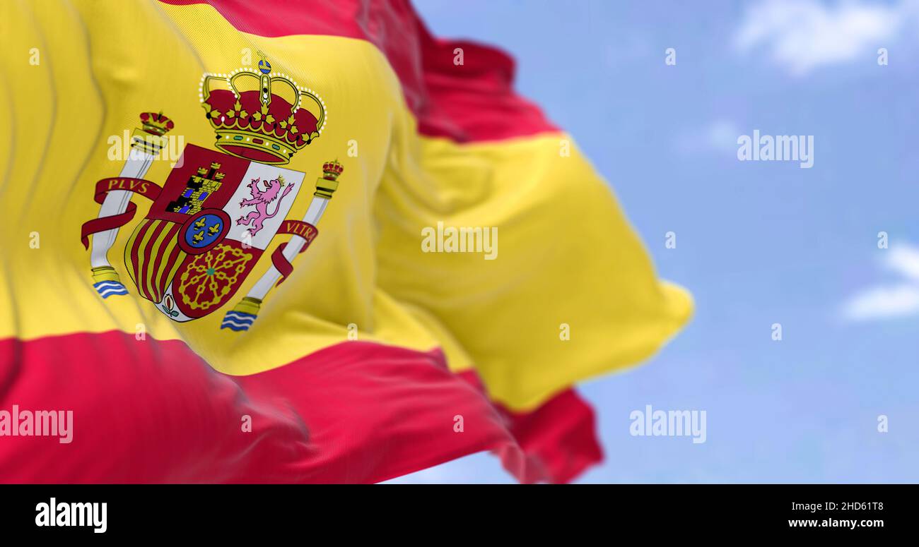 The national flag of Spain waving in the wind on a clear day. Selective ...