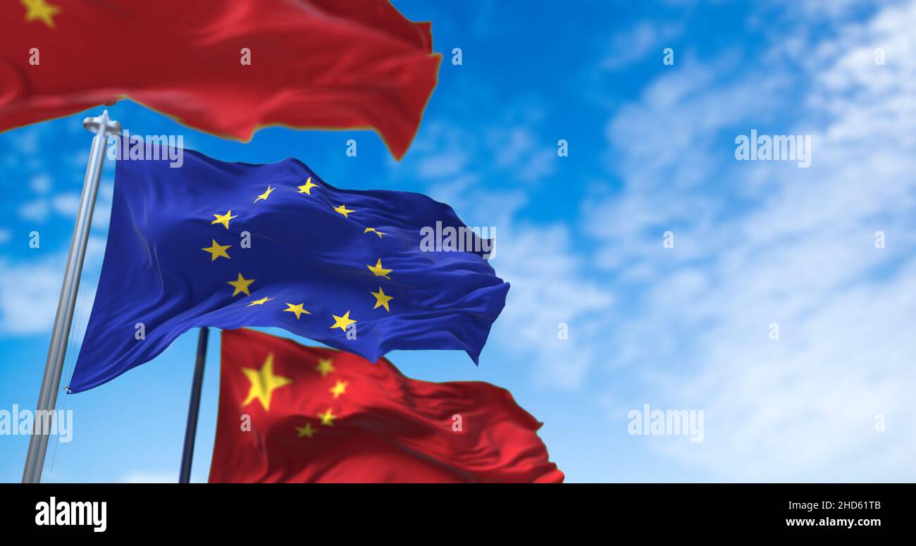 The flag of the European Union waving between two national flags of ...