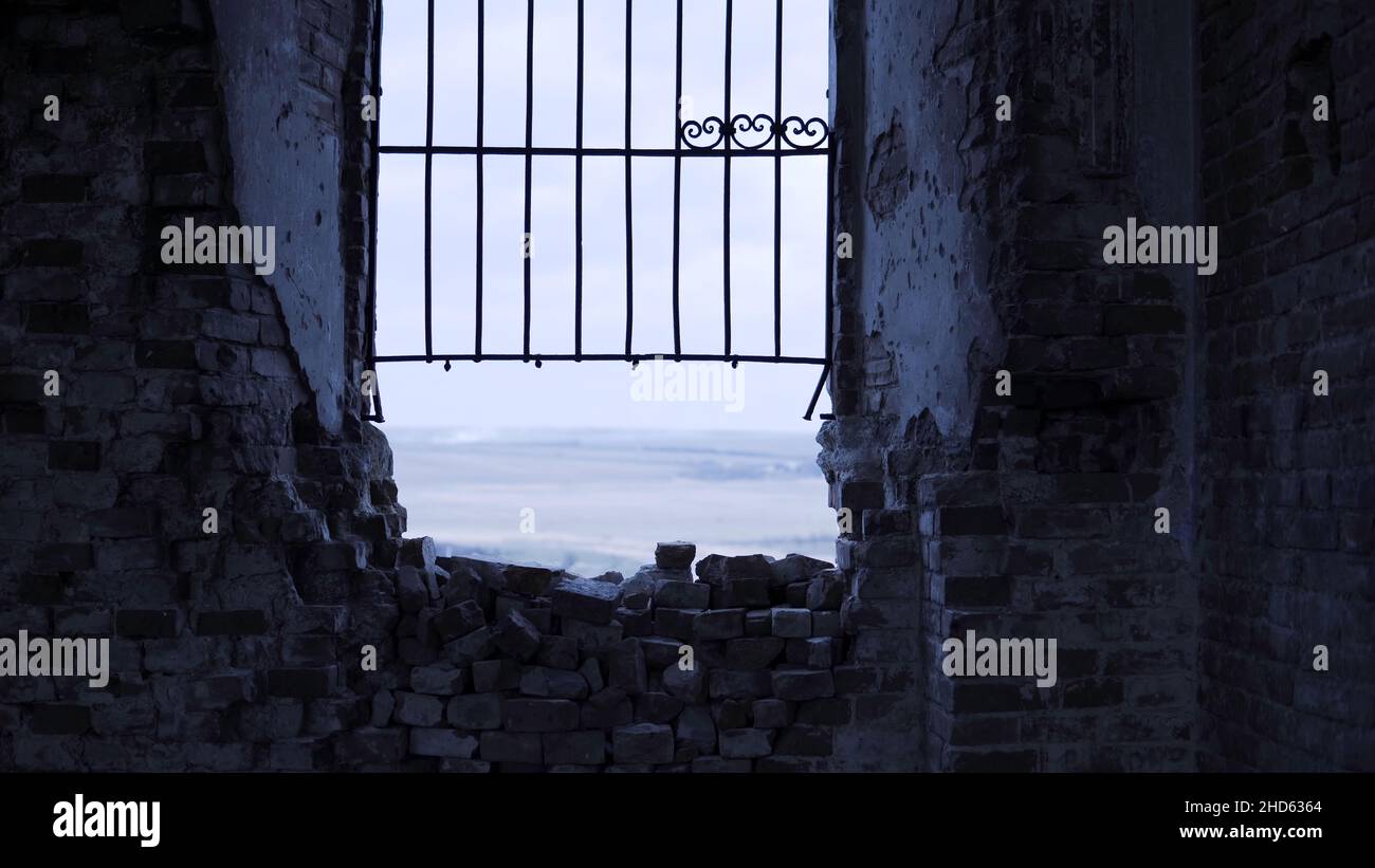 Window frame looking towards small village, green fields and blue ...